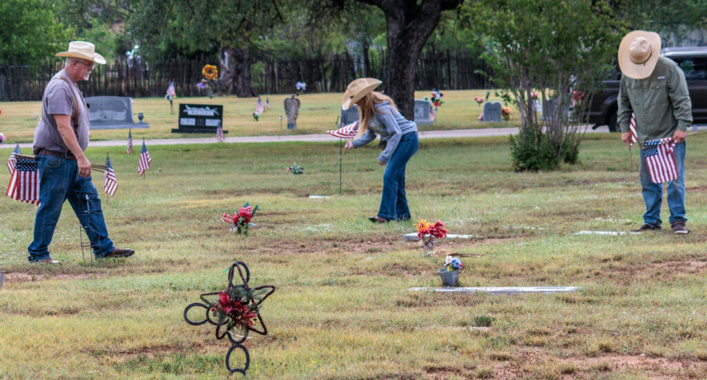 Volunteers place flags on veterans’ graves; Memorial Day ceremony set ...
